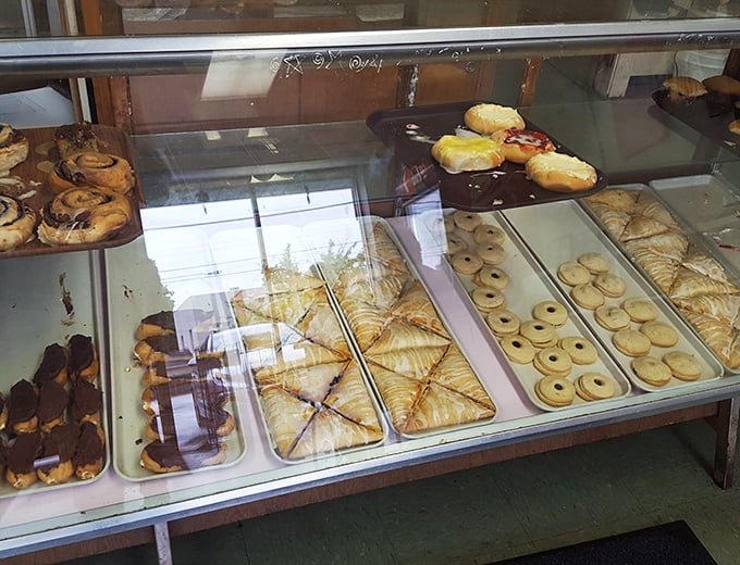 Pastry perfection on parade! From flaky croissants to golden danishes, this case is a United Nations of baked goods.