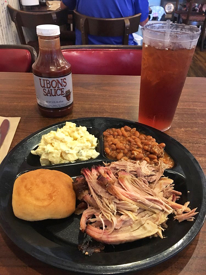 A platter fit for a king! Pulled pork, creamy slaw, and beans - it's like a flavor party, and you're the guest of honor.