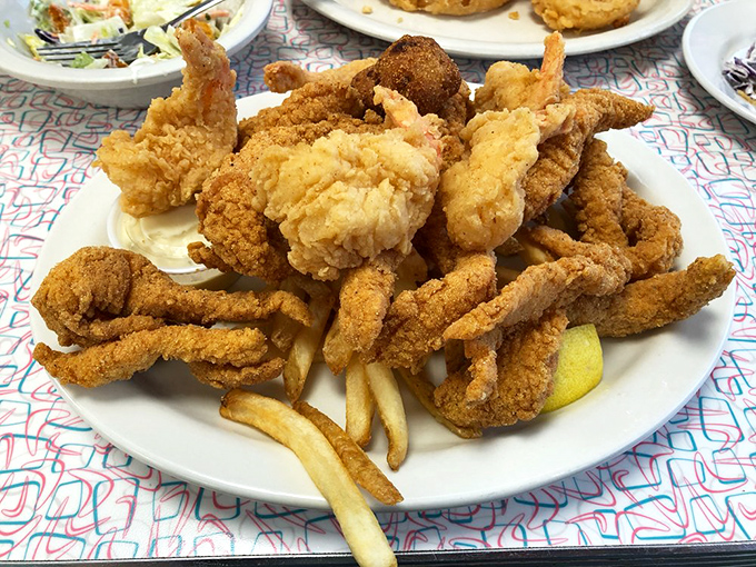 The ocean called, it wants its deliciousness back! This seafood platter is a treasure trove of crispy, golden goodness.