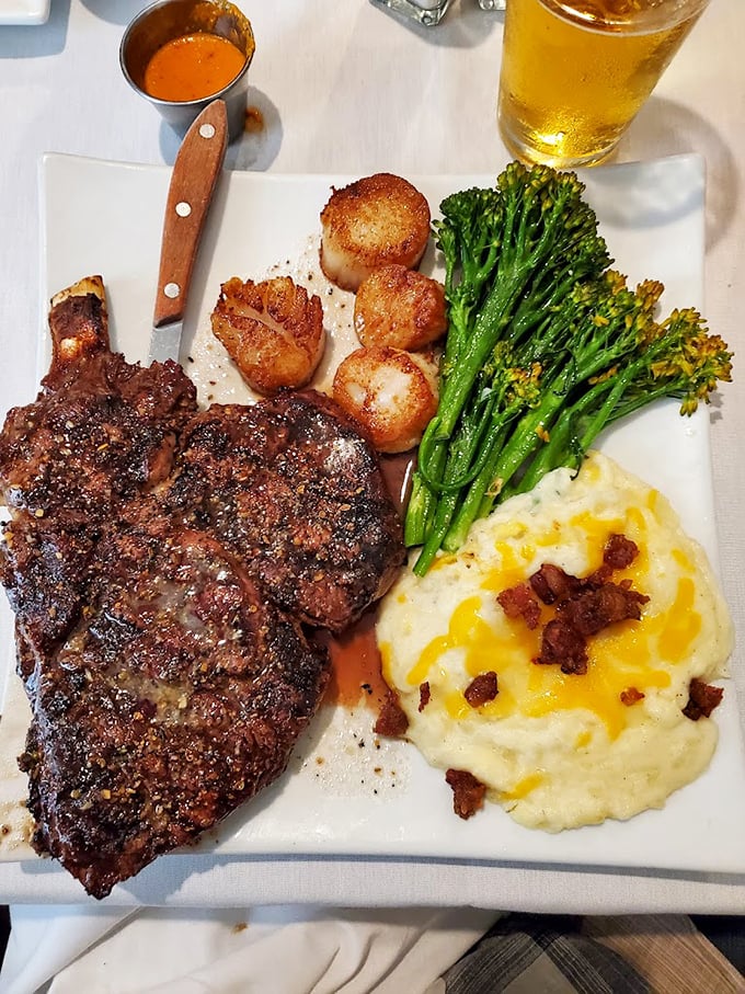 A steak that's been introduced to fire and seasoning with just the right amount of respect, alongside scallops and proper mashed potatoes.