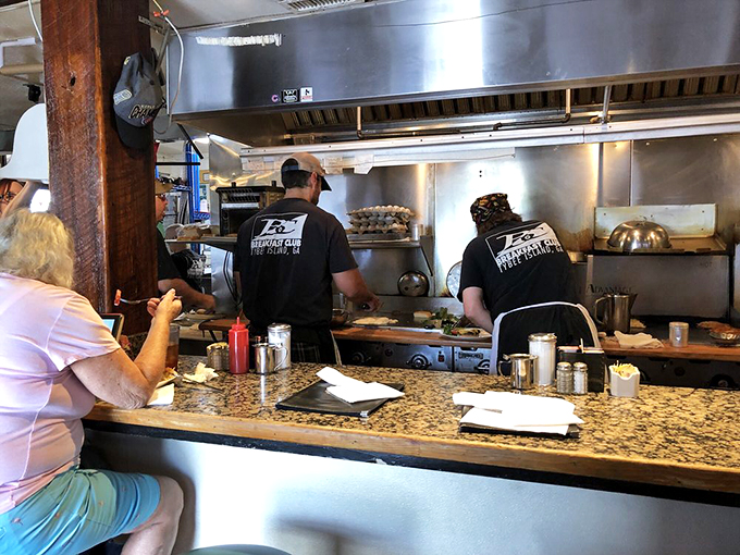 Breakfast wizards at work. These culinary maestros orchestrate a symphony of sizzles and flips that would make Mozart jealous.