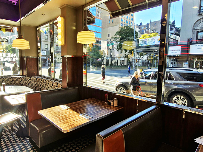 Window seat to the world. These cozy booths offer prime people-watching real estate, perfect for observing the TriBeCa hustle while you leisurely sip your coffee.