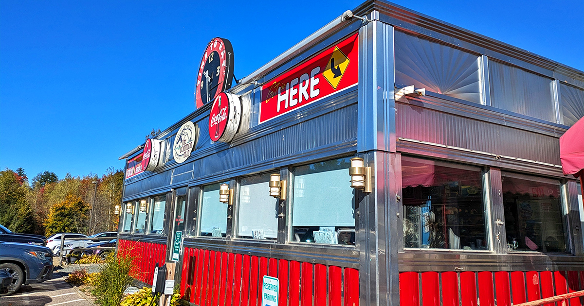 Step back in time! This retro diner's exterior is like a beacon calling all hungry time-travelers. Red, white, and chrome &ndash; the holy trinity of diner design.