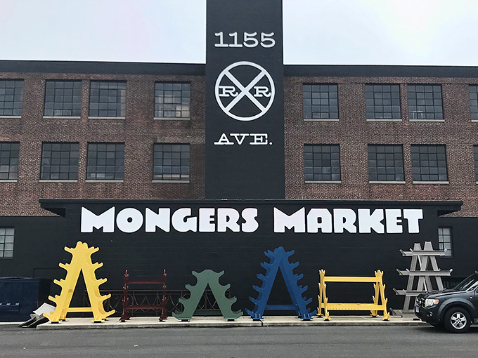 The iconic red brick and black smokestack of Mongers Market stands proudly on Railroad Avenue, a beacon for treasure hunters and nostalgia seekers.
