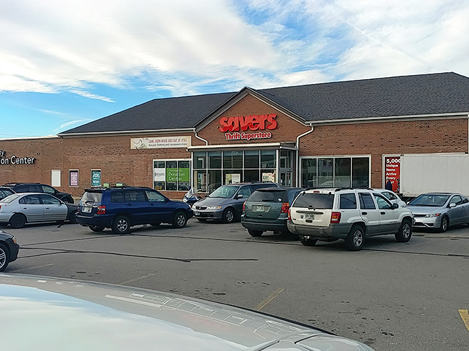 The iconic red Savers sign beckons like a lighthouse for bargain hunters, promising treasures within those brick walls that would make any thrift enthusiast's heart skip a beat.