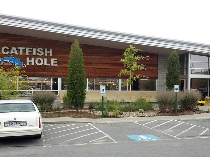 The Catfish Hole's modern exterior might fool you, but that blue catfish sign promises old-school Southern delights waiting inside.