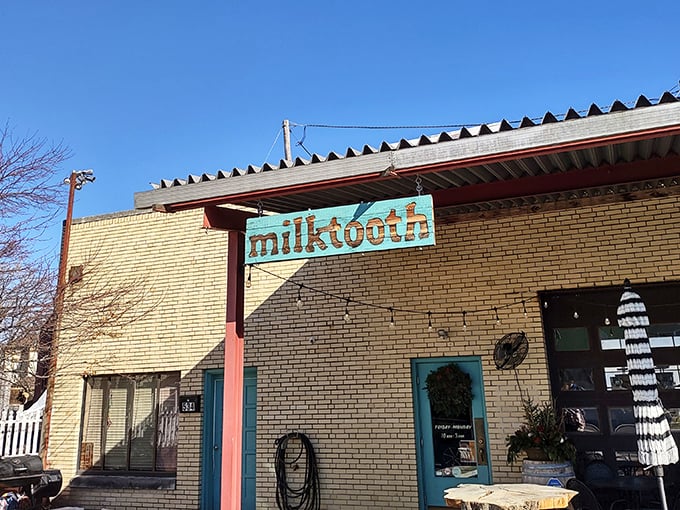 The former auto repair shop now fixes hunger pangs instead of carburetors. Milktooth's unassuming exterior hides culinary treasures within, like finding a Rolex at a yard sale.