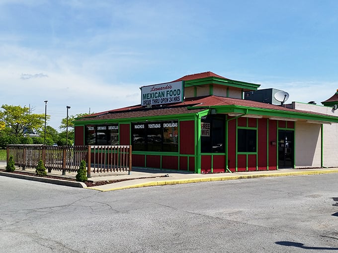 The vibrant red and green exterior of Leonardo's stands like a colorful beacon of culinary promise on Indy's west side.