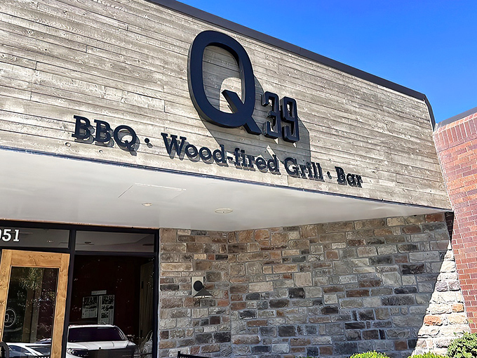 The modern rustic facade of Q39 South beckons like a temple of smoke, where wood and stone promise barbecue enlightenment awaits inside.
