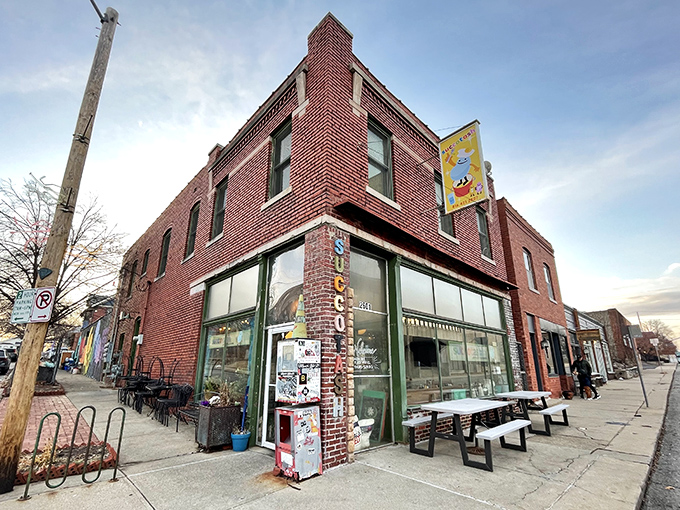 The iconic brick facade of Succotash welcomes hungry souls with its vintage vertical signage and promise of comfort food extraordinaire. 