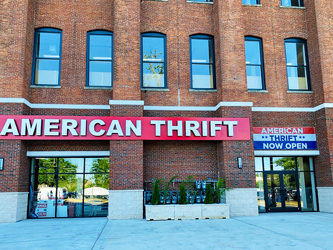 The brick facade of American Thrift Store stands like a temple to secondhand treasures, its bold red sign beckoning bargain hunters and nostalgia seekers alike.