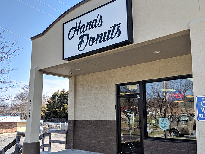 The unassuming storefront that houses Kansas City's donut nirvana. Like finding a treasure map in your attic, this sign promises delicious adventures ahead.