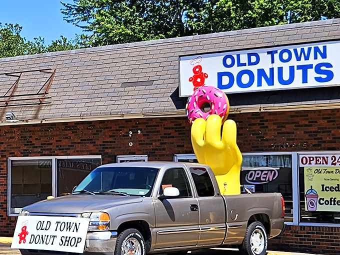 The brick facade of Old Town Donuts stands as a beacon of hope for sugar enthusiasts, promising 24-hour access to fried dough paradise.
