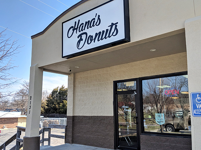 The unassuming storefront that houses Kansas City's donut nirvana. Like finding a treasure map in your attic, this sign promises delicious adventures ahead.
