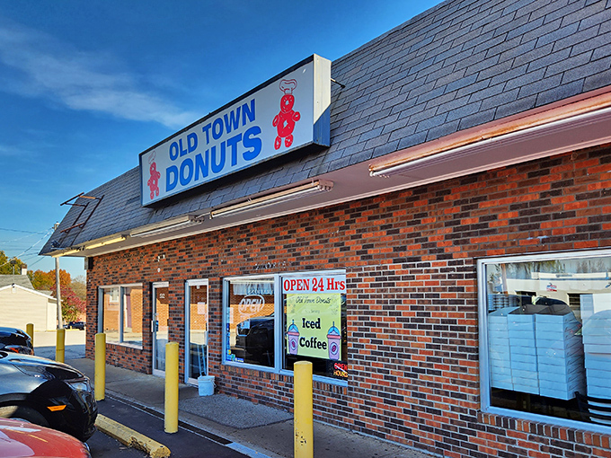 The brick facade of Old Town Donuts stands as a beacon of hope for sugar enthusiasts, promising 24-hour access to fried dough paradise.