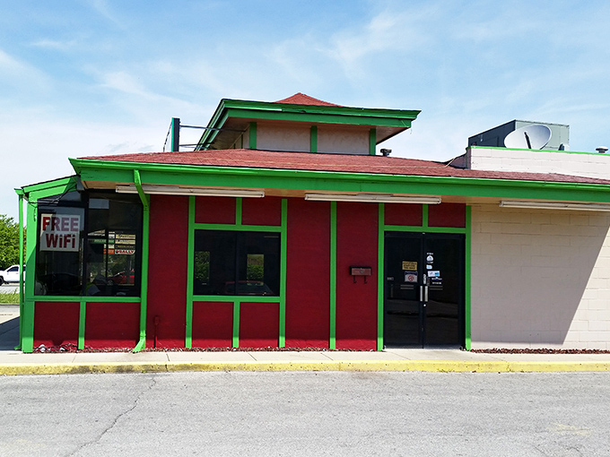 The vibrant red and green exterior of Leonardo's stands like a colorful beacon of culinary promise on Indy's west side.