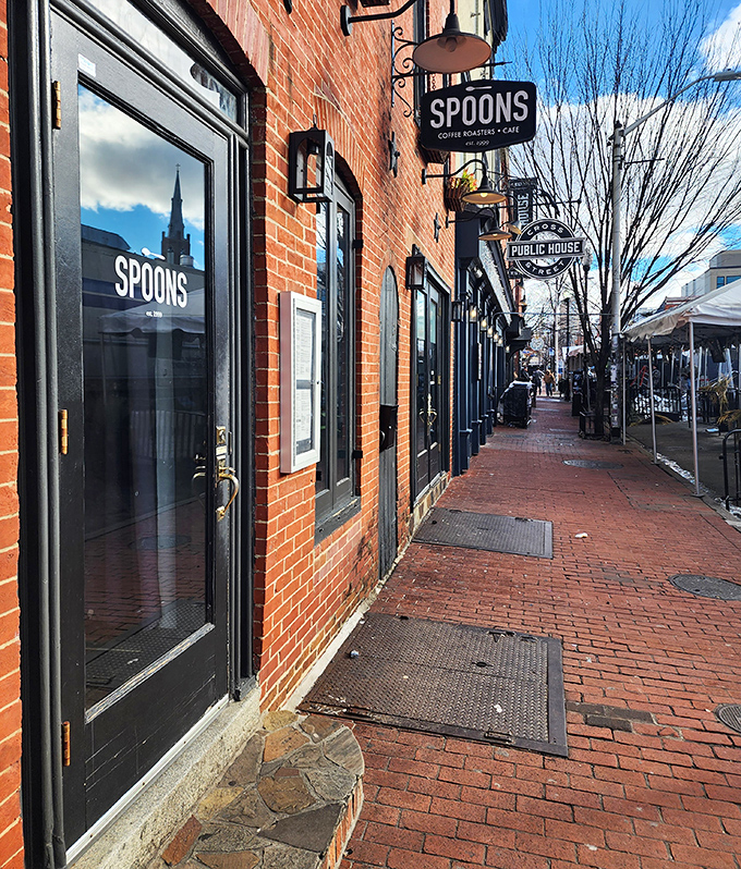 Spoons' classic brick exterior with its understated sign promises culinary treasures within. Federal Hill's breakfast landmark has been drawing crowds since 1999.