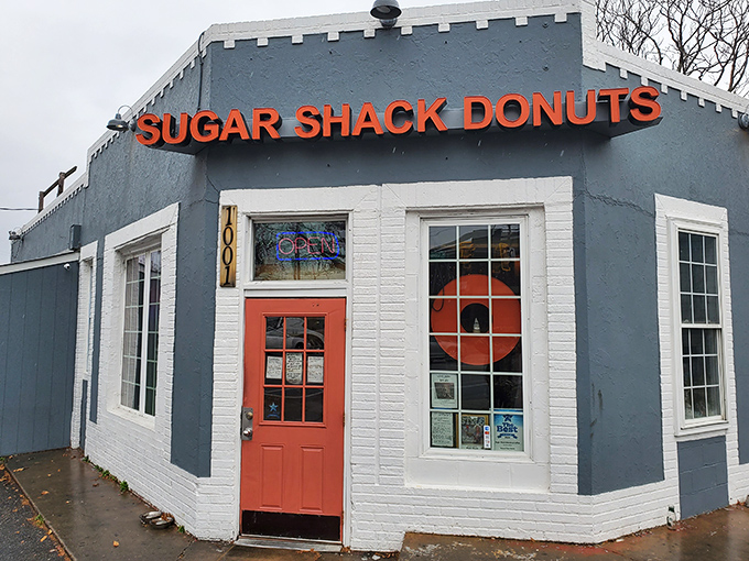 The blue-gray exterior with that coral door isn't just inviting&mdash;it's practically a siren song for your sweet tooth. Richmond's donut paradise awaits.