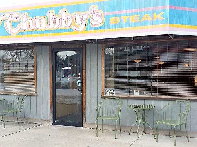 The iconic blue and pink awning of Chubby's beckons like a beacon to hungry travelers. Small-town charm with big-time flavor credentials.