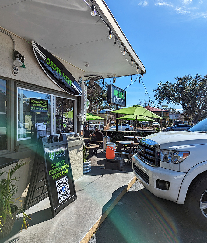 The bright green umbrellas and signage of Burrito Famous beckon like a culinary lighthouse in Gainesville's sea of chain restaurants.