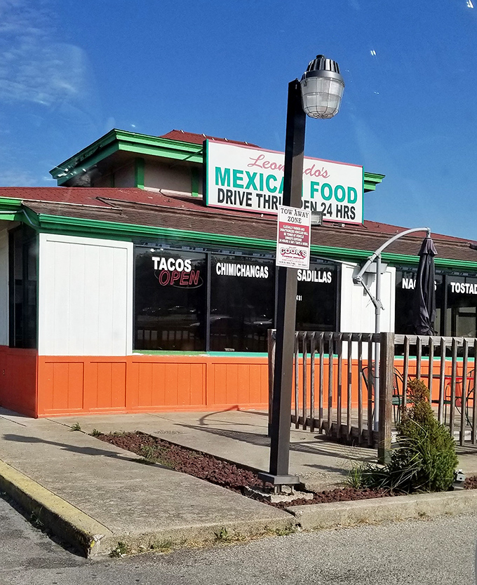 The vibrant red and green exterior of Leonardo's stands like a colorful beacon of culinary promise on Indy's west side.