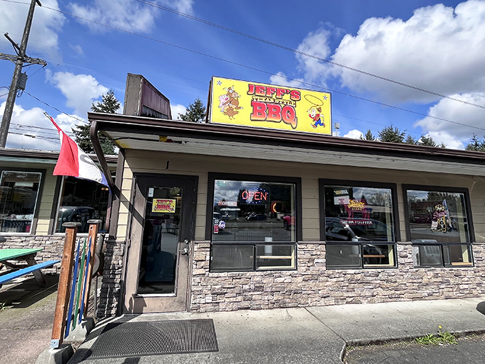 The bright yellow sign beckons like a smoky siren call to barbecue pilgrims. This unassuming Marysville storefront houses meat magic that would make a Texan weep with joy.