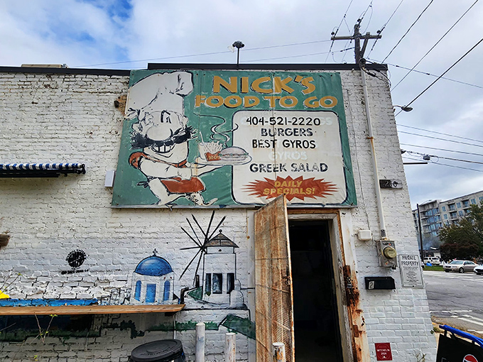 The unassuming white brick fa&ccedil;ade of Nick's Food To Go stands like a culinary lighthouse in Atlanta's urban landscape, beckoning hungry souls with its vintage sign.
