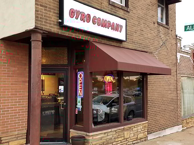 The unassuming brick storefront that houses culinary greatness. Like Superman's phone booth, this modest exterior disguises extraordinary powers within.