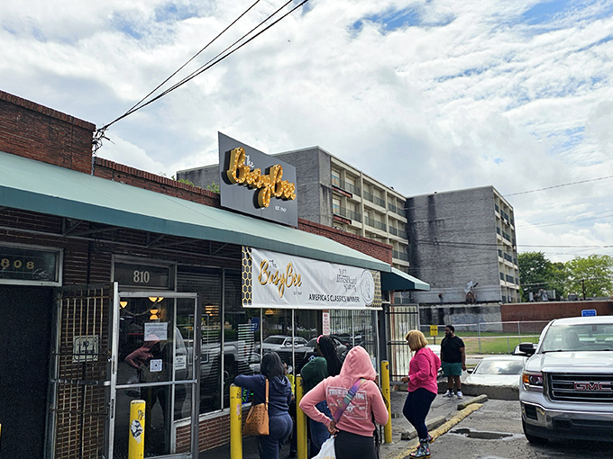 The iconic yellow and blue sign beckons like a lighthouse for hungry souls. Busy Bee has been Atlanta's fried chicken sanctuary since 1947.