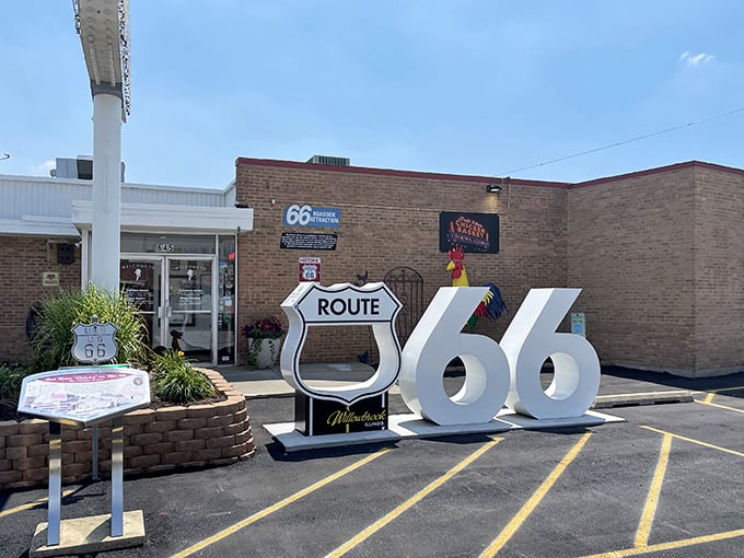 The iconic sign and Route 66 shield welcome hungry travelers like a beacon of fried chicken salvation.
