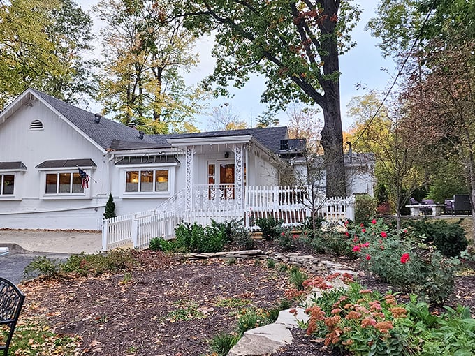 Hollyhock Hill's charming white exterior promises comfort before you even step inside, like a warm hug from your favorite aunt.