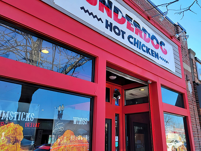 The bold red storefront of Underdog Hot Chicken stands out like a beacon for spice-seekers. Boston's hottest chicken joint announces itself without apology. 