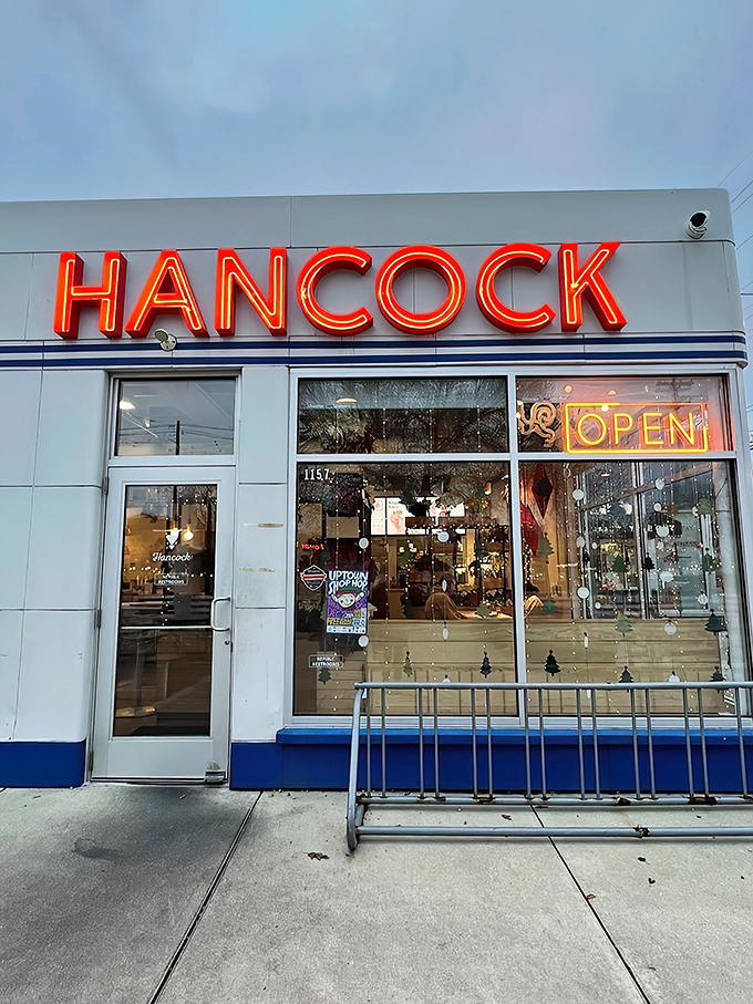 That neon sign isn't just announcing a restaurant—it's broadcasting a siren call to fried chicken lovers across Grand Rapids. The retro-modern exterior promises delicious things within.