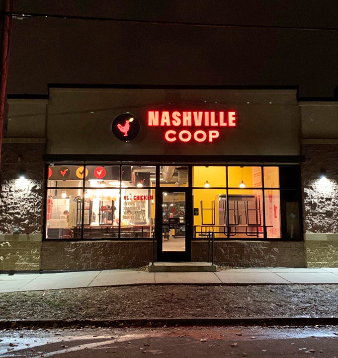 The beacon of spicy salvation glows in St. Paul! Nashville Coop's iconic sign promises a southern heat wave that Minnesotans have enthusiastically embraced.