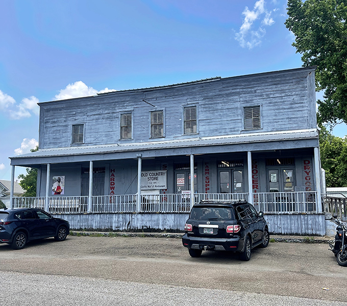 The weathered clapboard exterior of The Old Country Store stands as a time capsule from the 1800s, beckoning hungry travelers with rustic charm.