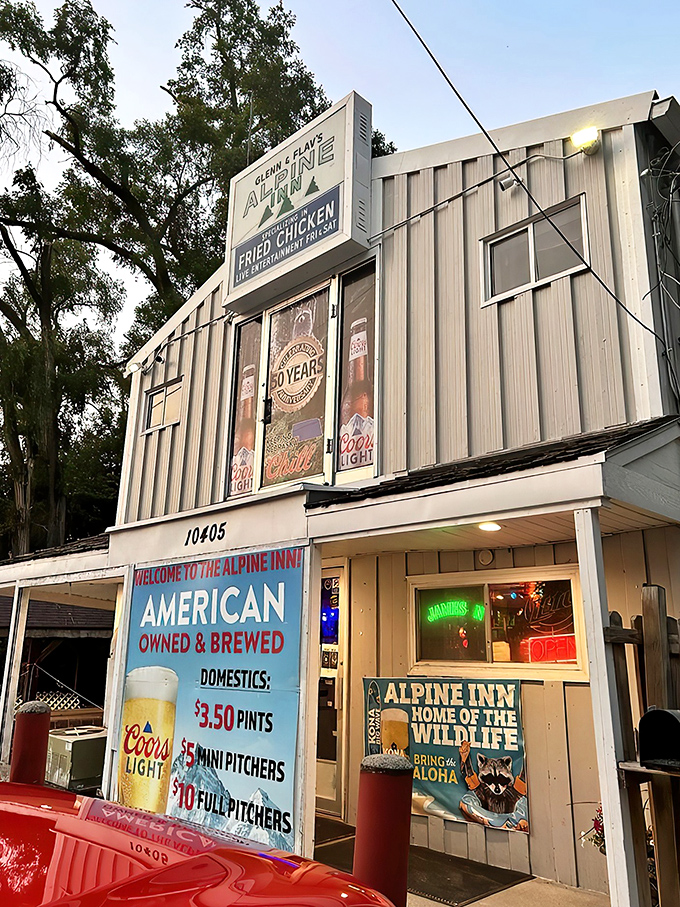 The bright turquoise exterior of Alpine Inn stands like a beacon of comfort food in northeast Omaha, promising fried chicken worth the journey.