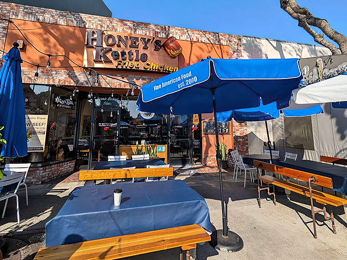The vibrant orange facade of Honey's Kettle beckons like a beacon of fried chicken salvation on a hungry Culver City afternoon.