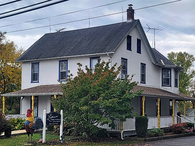 The white farmhouse exterior of Lettie's Kitchen stands like a culinary beacon in Hockessin, promising comfort food that transcends the ordinary.