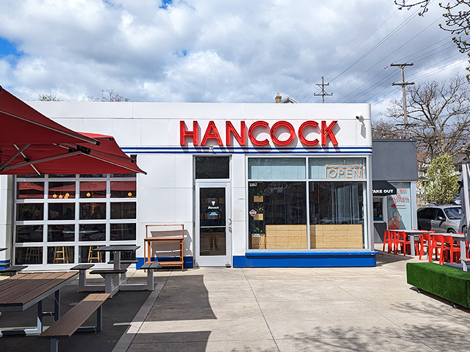 That neon sign isn't just announcing a restaurant—it's broadcasting a siren call to fried chicken lovers across Grand Rapids. The retro-modern exterior promises delicious things within.