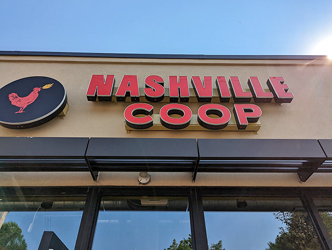 The beacon of spicy salvation glows in St. Paul! Nashville Coop's iconic sign promises a southern heat wave that Minnesotans have enthusiastically embraced.