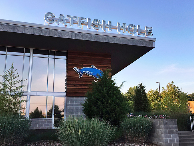 The Catfish Hole's modern exterior might fool you, but that blue catfish sign promises old-school Southern delights waiting inside.