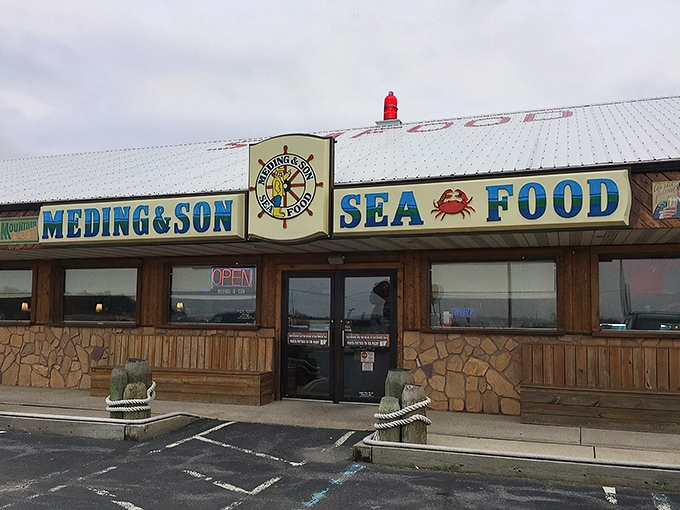 The unassuming exterior of Meding's Seafood stands like a siren call to hungry travelers. No fancy frills, just the promise of seafood treasures within.