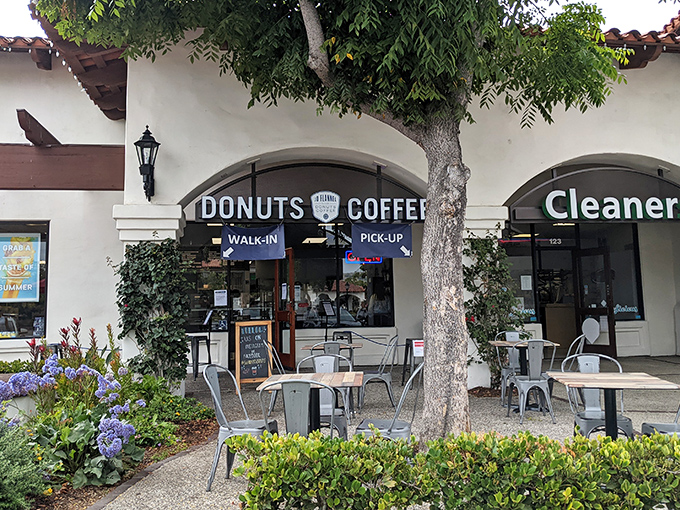The unassuming storefront that houses donut greatness. Blue banners and simple signage &ndash; no flash, all substance.