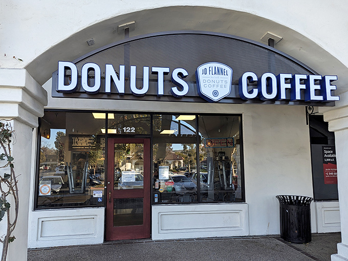 The unassuming storefront that houses donut greatness. Blue banners and simple signage &ndash; no flash, all substance.