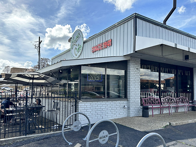 Louie's circular sign has beckoned hungry Baton Rouge residents since 1941—a beacon of breakfast hope against the Louisiana sky.