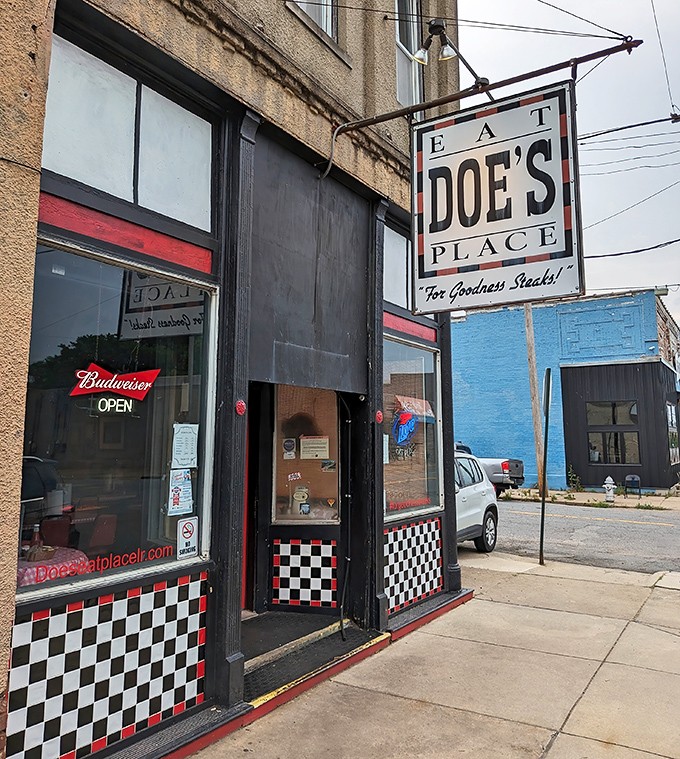 The unassuming exterior of Doe's Eat Place hides culinary greatness within, like finding a diamond in your backyard. That yellow truck knows what's up!
