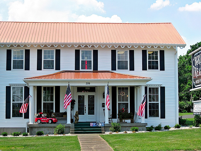 The stately white colonial exterior with its copper roof and American flags isn't just a building&mdash;it's a promise of treasures waiting inside.