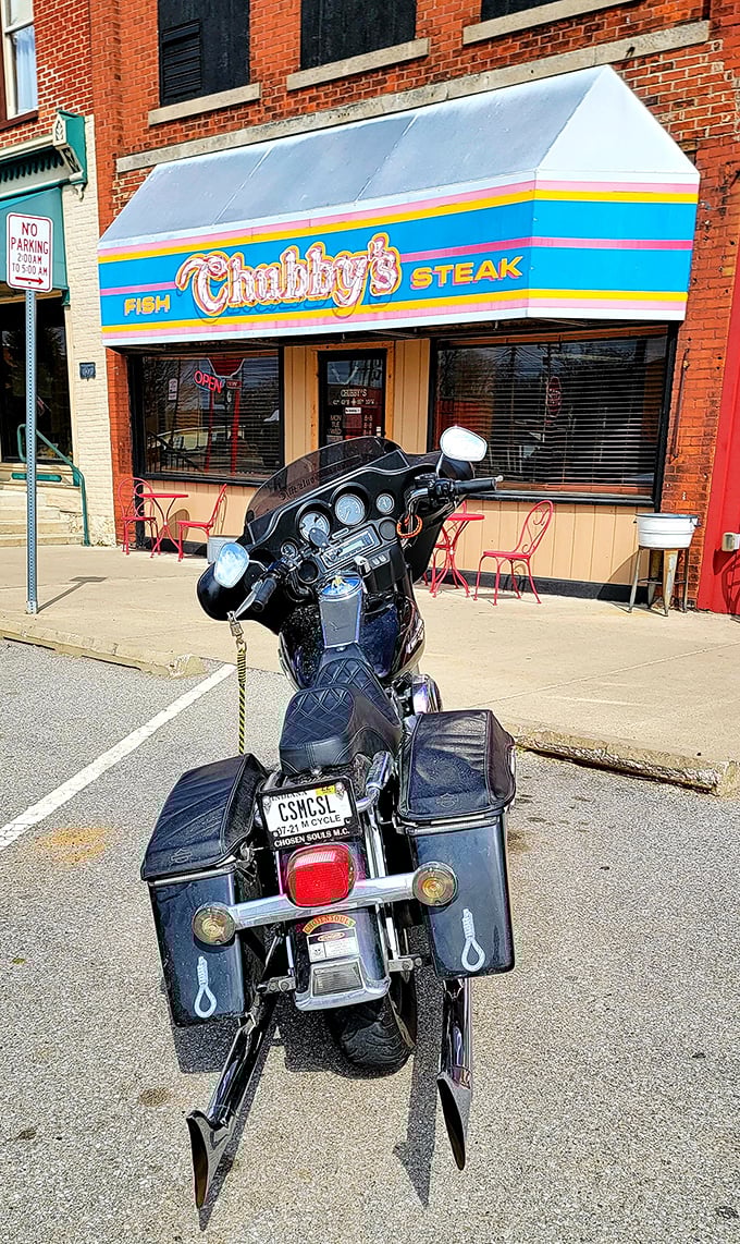 The iconic blue and pink awning of Chubby's beckons like a beacon to hungry travelers. Small-town charm with big-time flavor credentials.