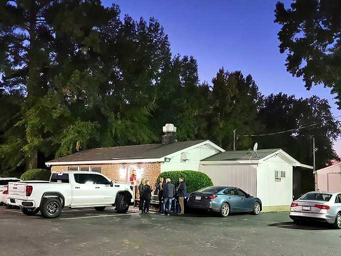 The unassuming exterior hides culinary greatness like a superhero's secret identity. Hungry pilgrims gather outside, knowing what awaits.