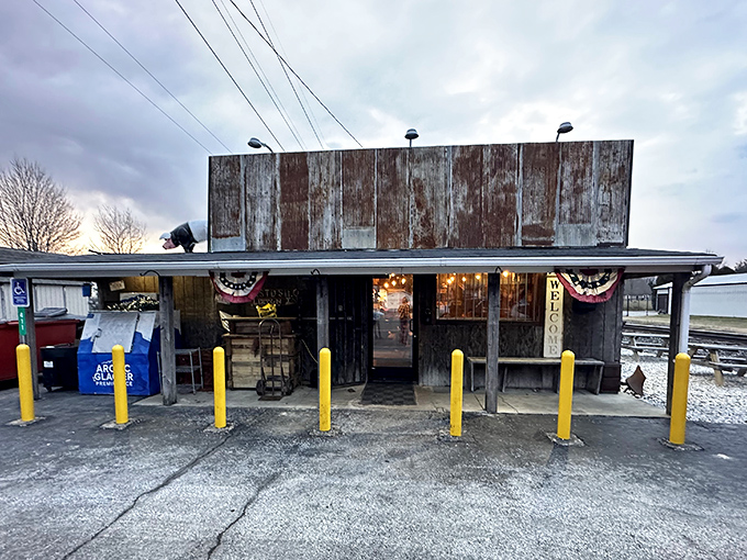 The weathered exterior of Rusted Silo isn't just authentic&mdash;it's a time machine disguised as a barbecue joint. Those yellow posts aren't just practical; they're exclamation points announcing culinary treasure.